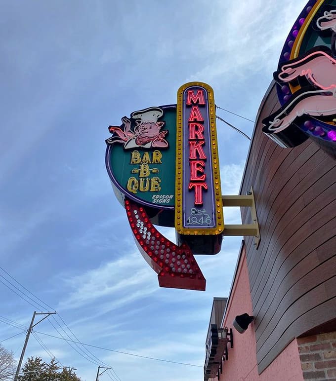 That vintage neon sign has been guiding hungry people to satisfaction for decades, glowing like a promise of good things to come.