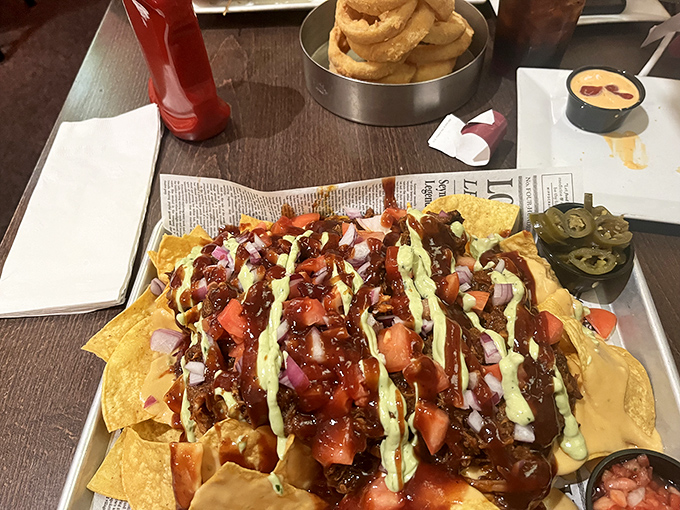 BBQ pulled pork nachos arrive loaded with melted cheese, jalape&ntilde;os, and tangy sauce &ndash; a shareable starter that disappears in record time.