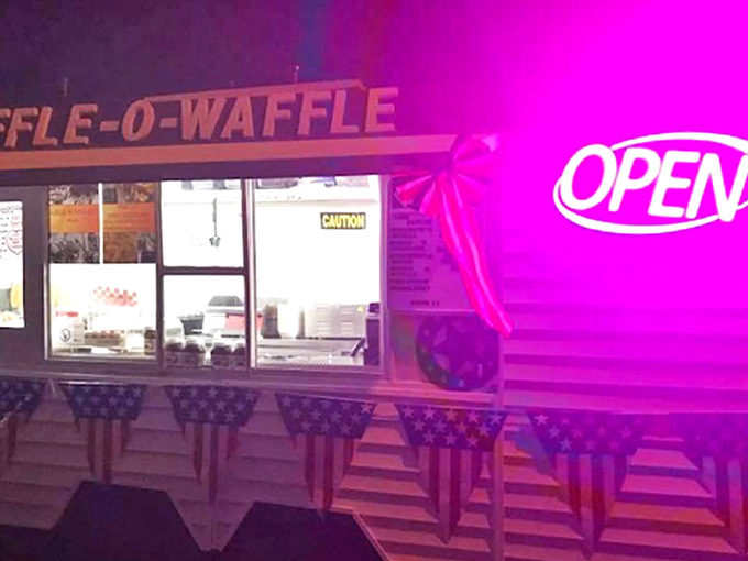 Neon Open Signage: The pink glow of the "OPEN" sign beckons night owls and early birds alike &ndash; a beacon of waffle possibility regardless of the hour.
