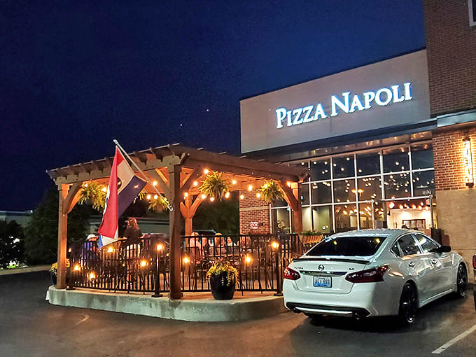When darkness falls, Pizza Napoli glows like a beacon of culinary hope for hungry travelers and locals alike.