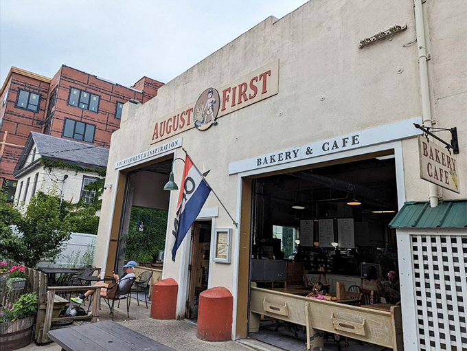 The outdoor seating area invites lingering conversations and people-watching while enjoying Vermont's perfect summer days.