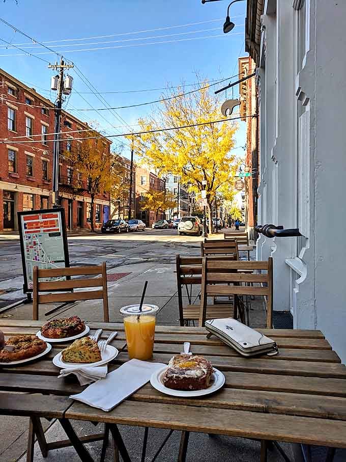 The perfect Cincinnati moment &ndash; fresh pastries, juice, and coffee enjoyed at an outdoor table while autumn colors paint the street.