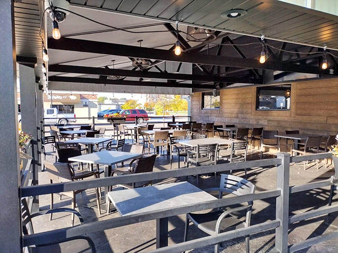 This spacious patio with its modern furniture proves Jimmy's Pour House knows that sometimes the best dining room has no roof at all.