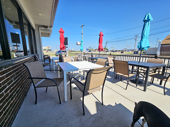 Colorful umbrellas shade the outdoor seating area, creating the perfect spot for contemplating a second slice of pie while watching the world go by.