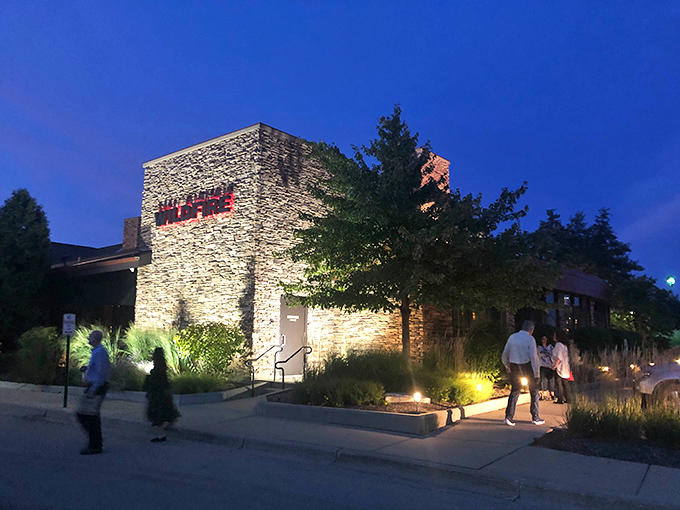 As dusk falls, Wildfire glows with invitation&mdash;the illuminated stone and warm lights beckoning hungry travelers toward delicious adventures.