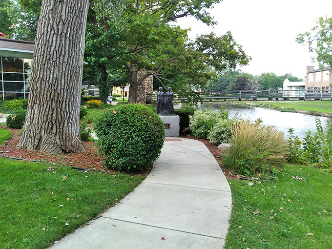 Winding concrete paths guide visitors through the castle grounds, the riverside walkway offering contemplative views that would have pleased Curwood himself.