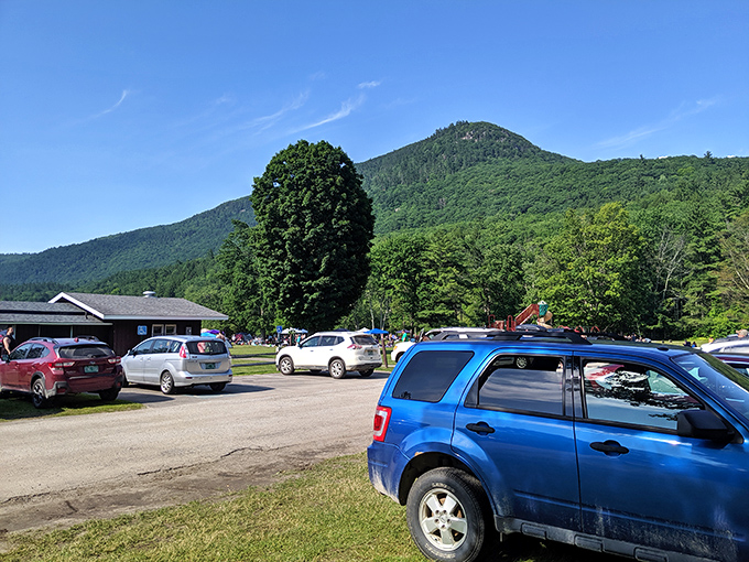 The modest parking area gives no hint of the natural wonders waiting just beyond, where Vermont's beauty unfolds in peaceful solitude.