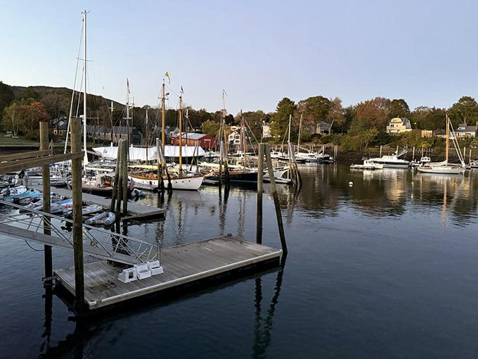The view from the patio stretches across the harbor, where sailboats bob peacefully in water that sparkles like diamonds.