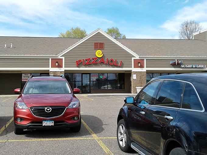 The unassuming exterior hides culinary treasures within, proving you can't judge a pizzeria by its strip mall location alone.