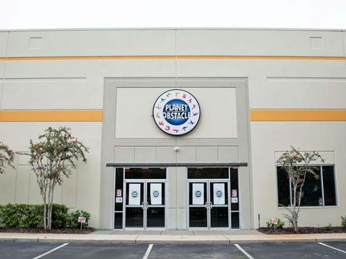 The Planet Obstacle sign promises Wisconsin families a world of adventure waiting just beyond those doors, regardless of weather outside.