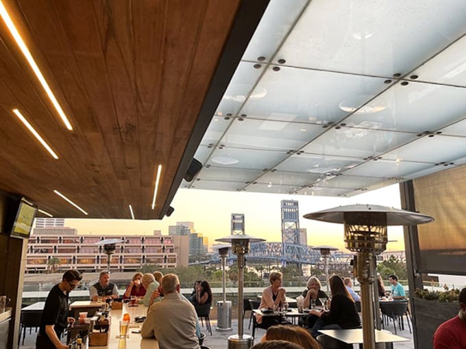 As the sun sets over the St. Johns River, Cowford's rooftop becomes Jacksonville's most coveted perch for drinks with a view.