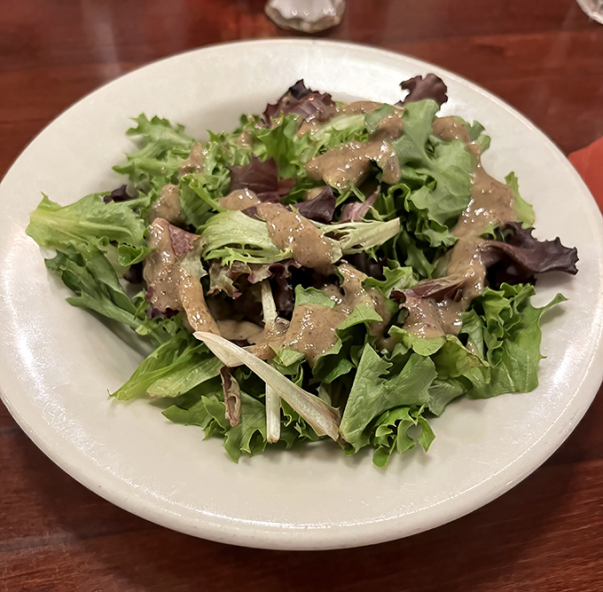 A simple side salad that proves even the supporting players at Sarducci's deserve a standing ovation &ndash; fresh, vibrant, and perfectly dressed.