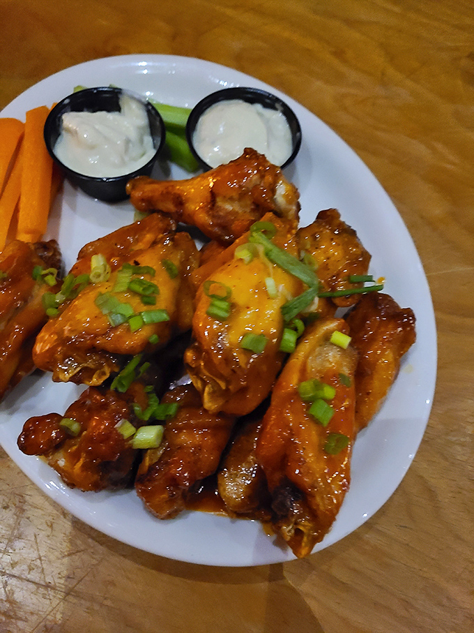 These sauce-slathered beauties demonstrate why wing aficionados make pilgrimages to this remote Vermont pizzeria &ndash; crispy, juicy, and utterly irresistible.