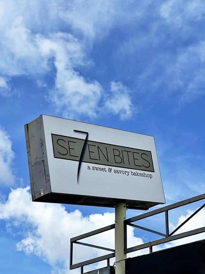 The iconic Seven Bites logo against a blue Orlando sky &ndash; a beacon for those seeking serious comfort food with a side of sunshine.