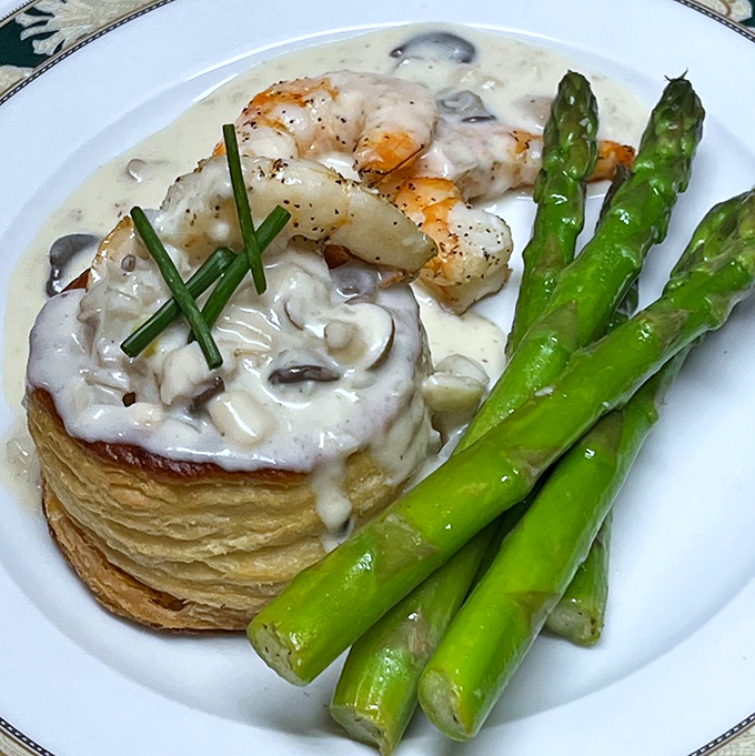 Puff pastry perfection! This shrimp vol au vent is like a fancy hat for your taste buds - elegant, impressive, and guaranteed to turn heads at the culinary party.