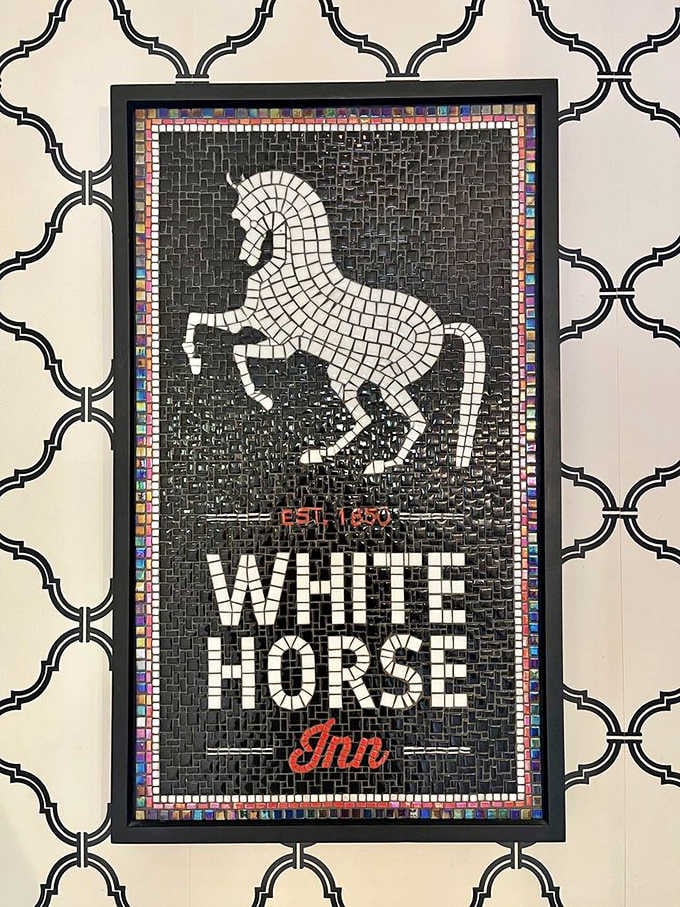 A mosaic masterpiece featuring the iconic white horse &ndash; this isn't just signage, it's functional art announcing culinary adventures await within.