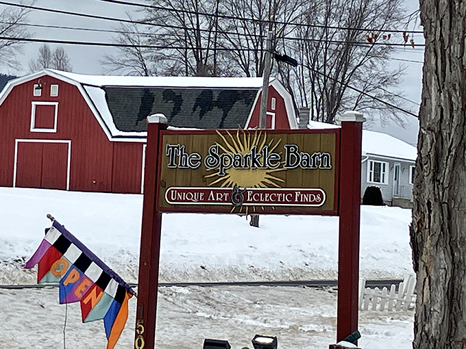 Snow may blanket Vermont, but The Sparkle Barn's sign promises warmth, whimsy, and "Unique Art & Eclectic Finds" that defy winter's monochromatic mood.