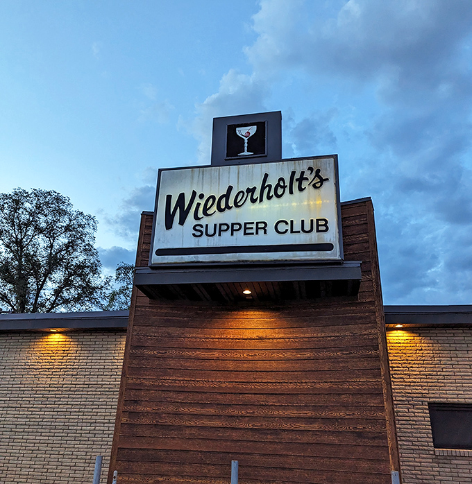 The iconic sign glows against twilight skies &ndash; a beacon for hungry travelers and locals who know where the good stuff is.