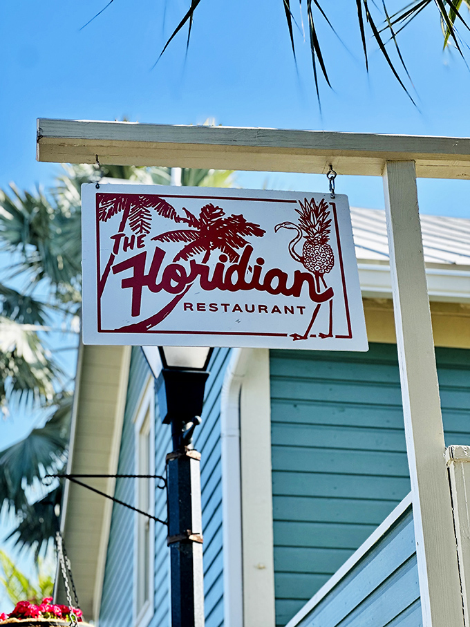 That iconic red sign with palm tree and pineapple – a beacon guiding hungry travelers to culinary happiness.