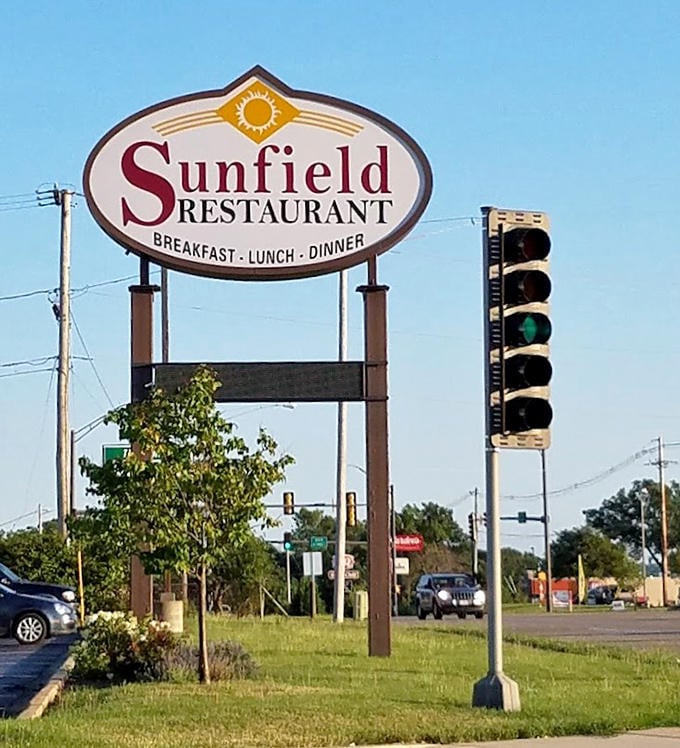 The park's welcome sign stands sentinel, promising natural wonders just beyond. Your adventure begins here.