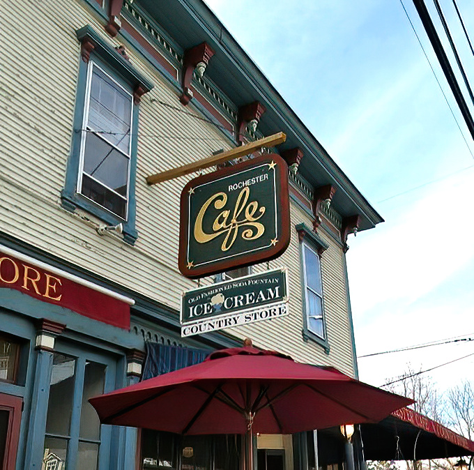 That sign isn't just advertising a caf&eacute; &ndash; it's announcing a Vermont institution where ice cream, coffee, and country store treasures await under one historic roof.