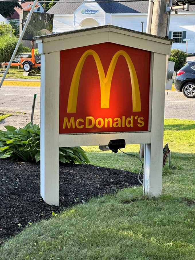 The iconic golden arches take a backseat to historical preservation, nestled discreetly on the property's tasteful signage.
