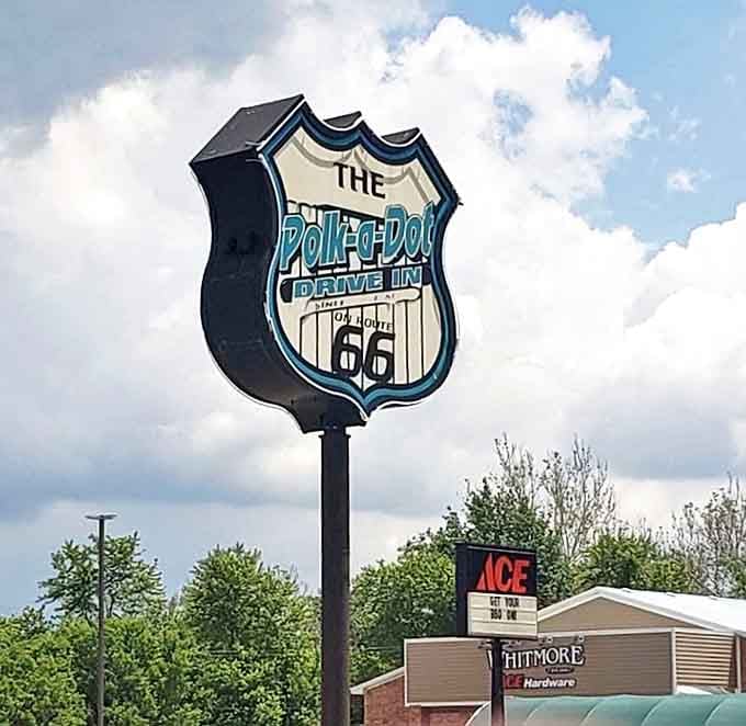 The iconic sign stands tall like a beacon of deliciousness, guiding hungry travelers to their happy place.