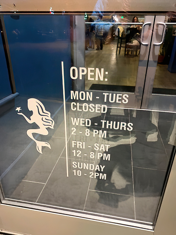 Even the hours posted on the door feature the restaurant's mermaid mascot &ndash; a whimsical touch that sets the tone for fun.