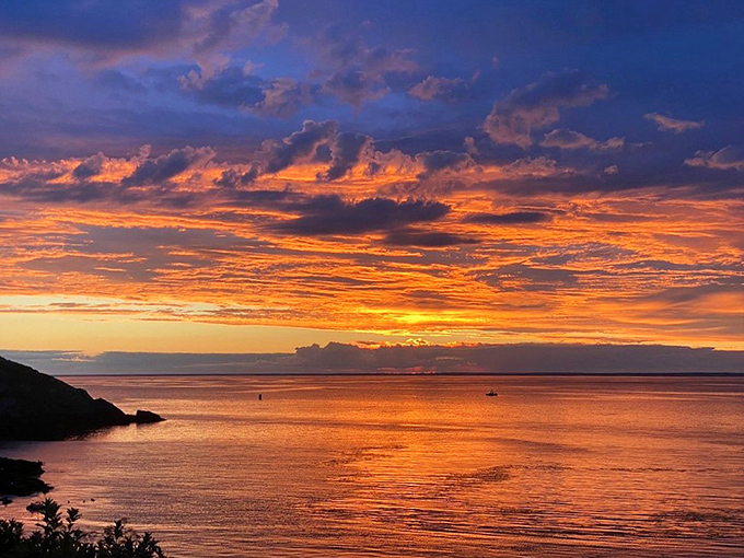As day surrenders to evening, Monhegan's sunset transforms the Atlantic into liquid gold, creating the perfect final memory of island magic.