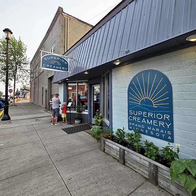 The corner view shows off Superior Creamery's welcoming presence on Grand Marais's main street, beckoning passersby with frozen temptation.