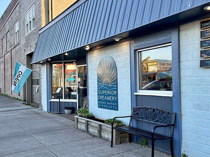 The storefront glows invitingly at dusk, that sunrise logo promising good things inside for anyone smart enough to stop rather than just drive past into the night.
