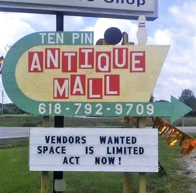 The retro bowling-themed sign points the way to antiquing paradise, its mid-century design a perfect preview of treasures within.