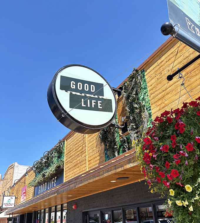 Flowers cascading from the awning announce this cafe's presence with cheerful authority, impossible to miss on Main Avenue.