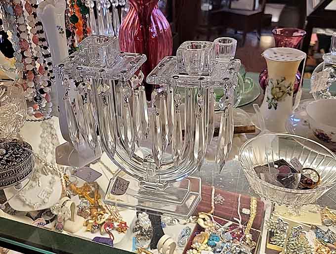 Delicate glass pieces and vintage accessories sparkle under careful lighting, each item representing celebrations, gatherings, and special moments from decades past.