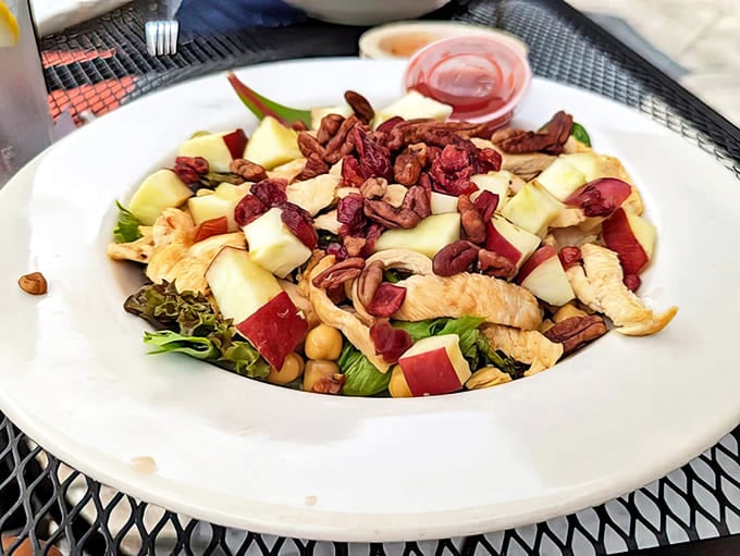 Waldorf salad: A refreshing counterpoint to the menu's richer offerings &ndash; crisp apples, tender chicken, and crunchy nuts creating a symphony of textures.