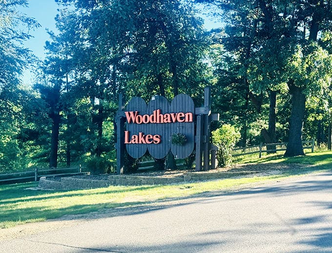 The Woodhaven Lakes sign marks the entrance to adventure, promising experiences that beat scrolling through social media any day.