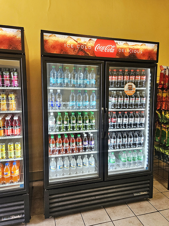 The beverage cooler stands ready &ndash; a colorful, perfectly organized battalion of refreshment options waiting to complement your sandwich selection.