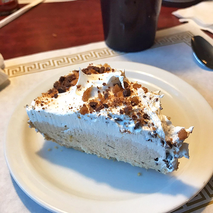 A slice of heaven on a plate. This cake doesn't just end the meal. It's the grand finale of a delicious symphony.