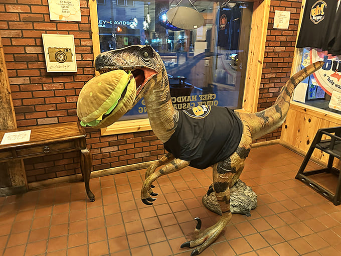 The restaurant's quirky dinosaur mascot, poised to devour a burger, perfectly captures Eh! Burger's spirit &ndash; serious about food, not about itself.