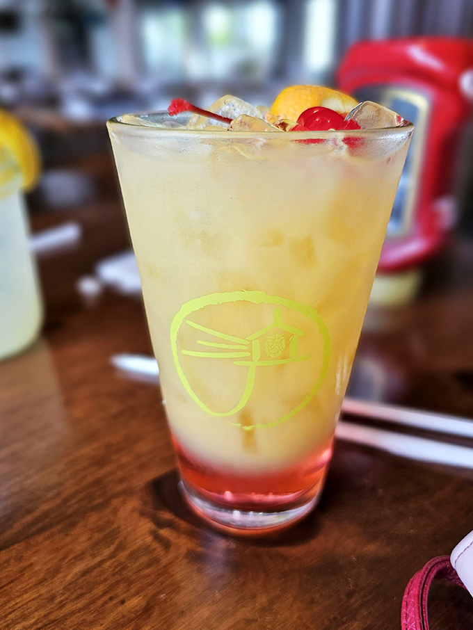 A refreshing cocktail garnished with fruit &ndash; because after all that seafood, you deserve something sweet with a kick!