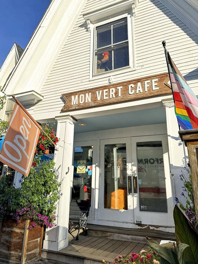 Welcome to flavor town: The inviting entrance with its colorful flags and "Open" sign promises culinary delights that exceed even the highest expectations.