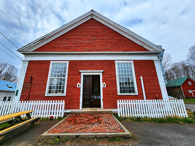 The welcoming entrance with its white picket fence and brick pathway practically whispers "come in and stay awhile" to everyone who passes by.