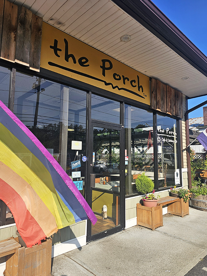 Rainbow flags and wooden planters frame the entrance, signaling that everyone's welcome to this breakfast paradise.
