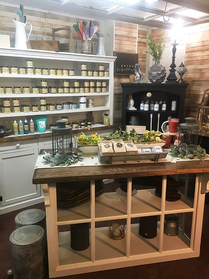 A beautifully arranged display of candles and home goods showcases the market's attention to detail &ndash; creating an atmosphere that feels more like discovery than shopping.