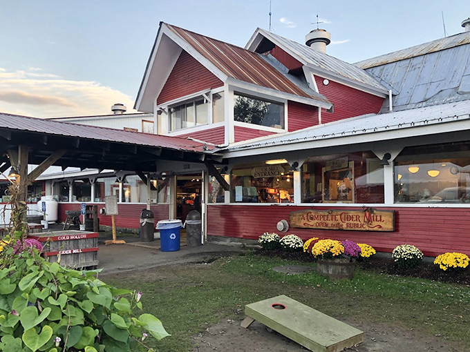 The exterior view showcasing seasonal flowers and outdoor seating &ndash; where Vermont's natural beauty provides the perfect backdrop for donut contemplation.