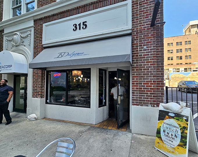 The welcoming entrance beckons passersby with promises of Southern comfort &ndash; step inside and prepare for a culinary journey that'll haunt your dreams.