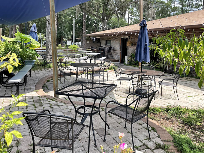 The outdoor patio offers a tranquil escape where Florida's natural beauty complements the culinary artistry happening inside.