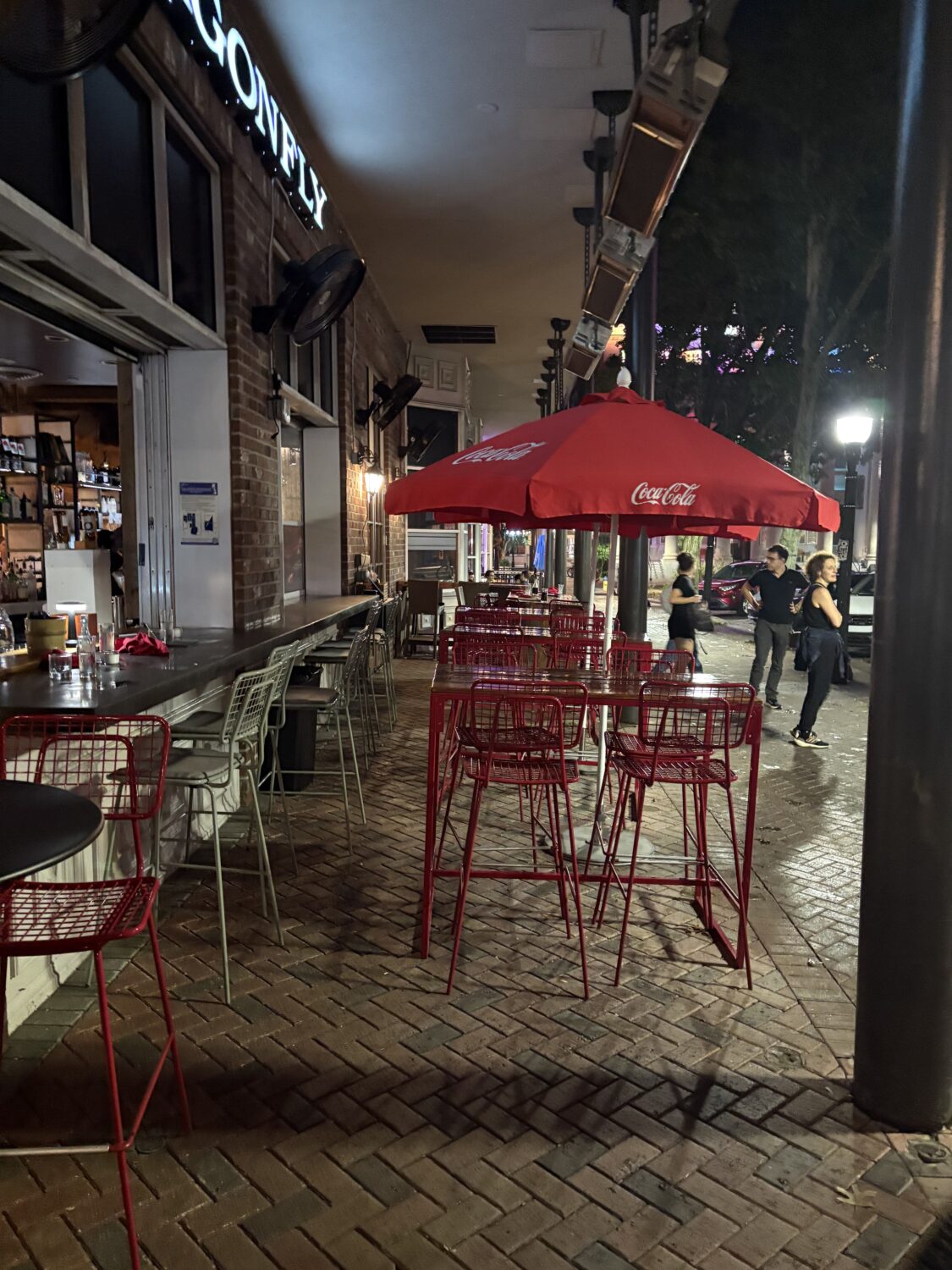 Red metal chairs pop against the herringbone brick patio – the perfect perch for people-watching while savoring spicy tuna and cold sake.