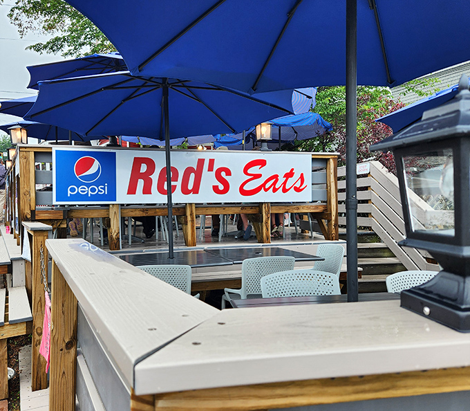 The outdoor seating area where lucky diners savor their hard-earned rewards after conquering the famous line at Red's Eats.