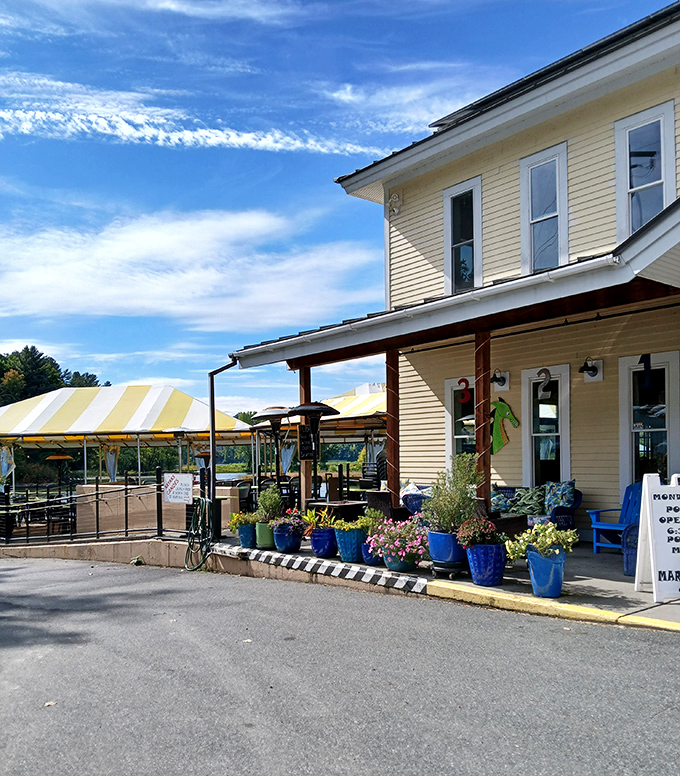 The Marina's exterior, adorned with colorful flower pots and a welcoming porch, promises the kind of authentic Vermont experience that keeps visitors coming back.